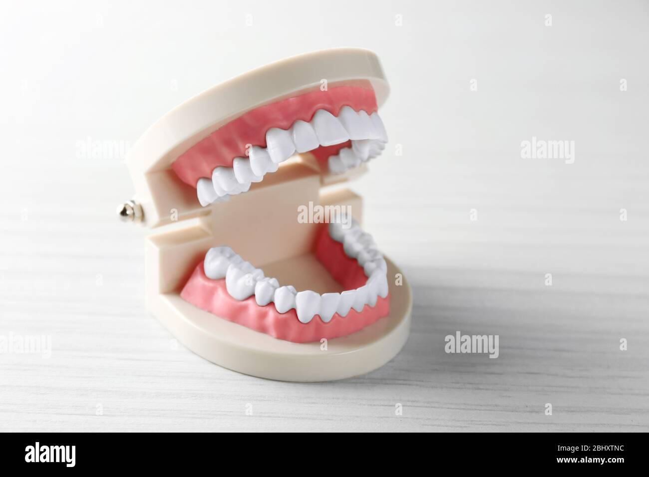 White teeth on table background Stock Photo - Alamy