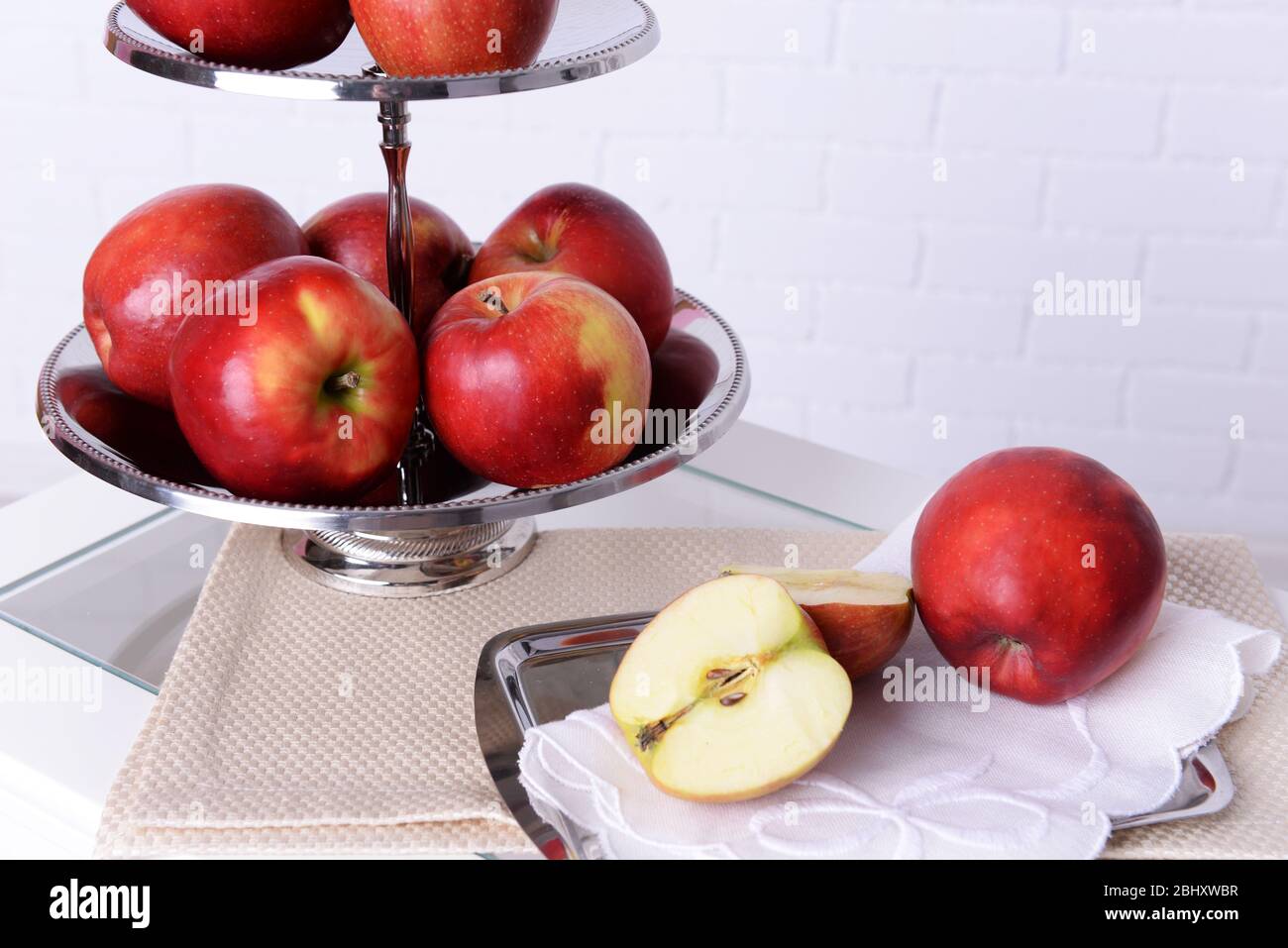Tasty ripe apples on serving tray on table close up Stock Photo - Alamy