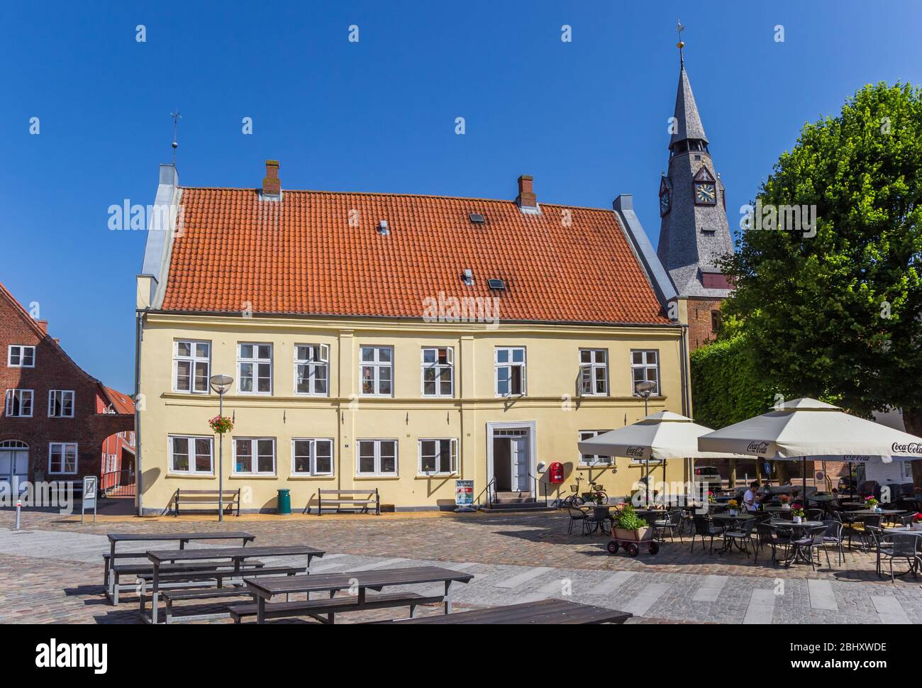 Town square with restaurant and church tower in Tonder, Denmark Stock ...