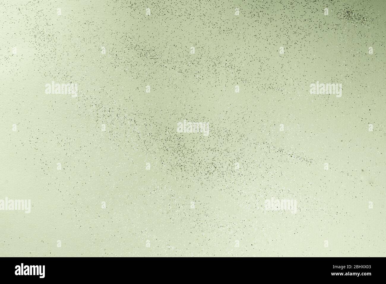 green backgdrop with silver sequins and bokeh from sequins. festive ...