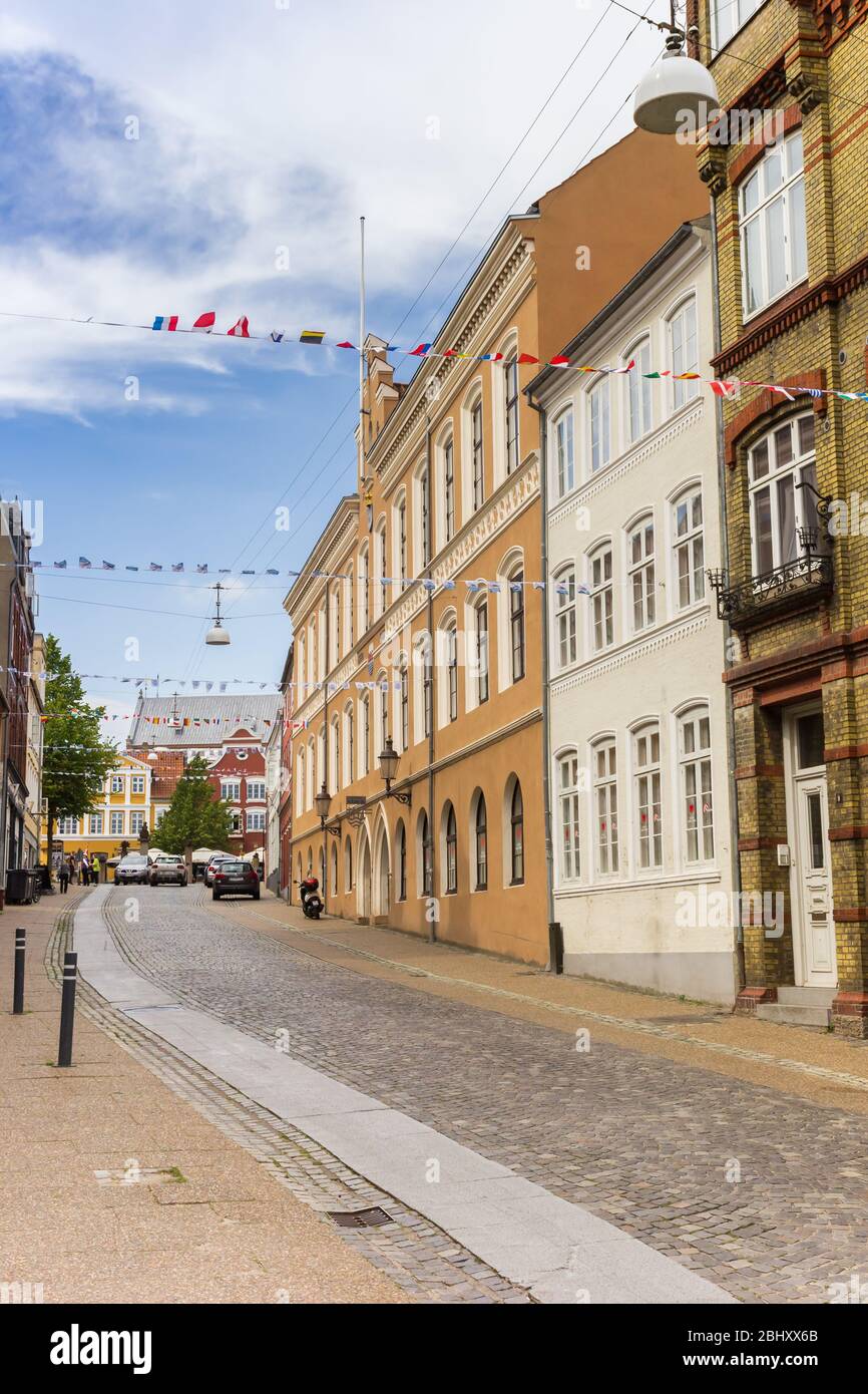 Historic houses and little flags in the center of Haderslev, Denmark ...