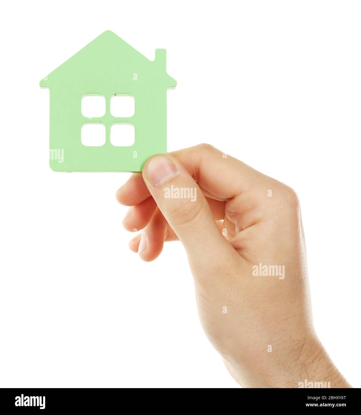 Female hand holding house isolated on white Stock Photo - Alamy