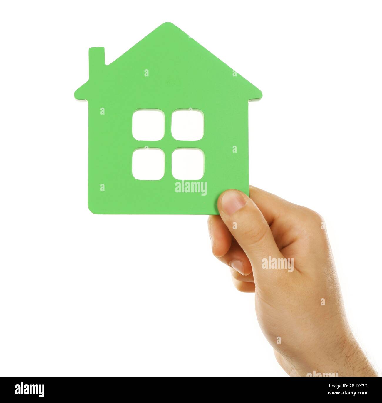 Female hand holding house isolated on white Stock Photo - Alamy