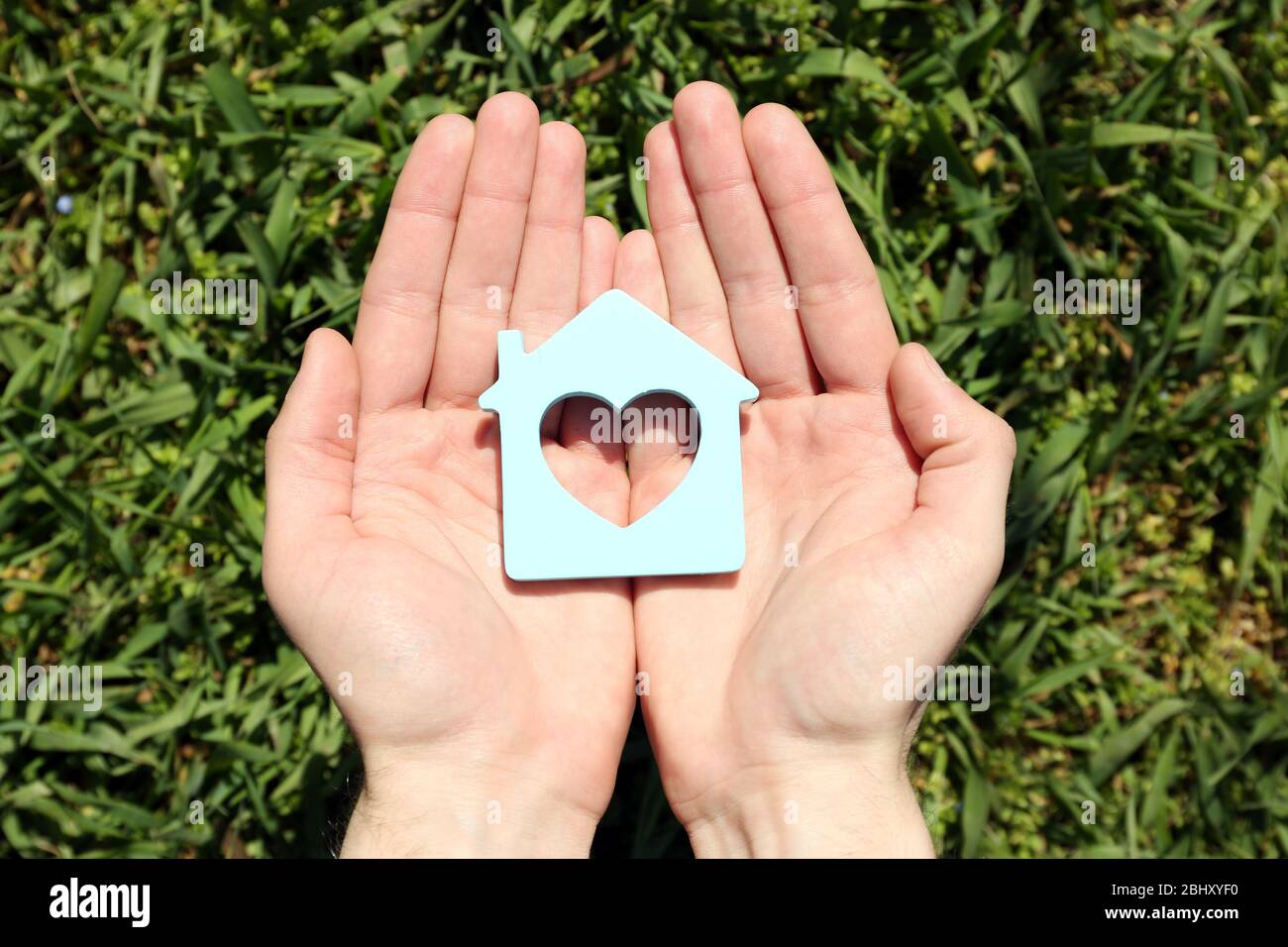 Hands over small house hi-res stock photography and images - Alamy