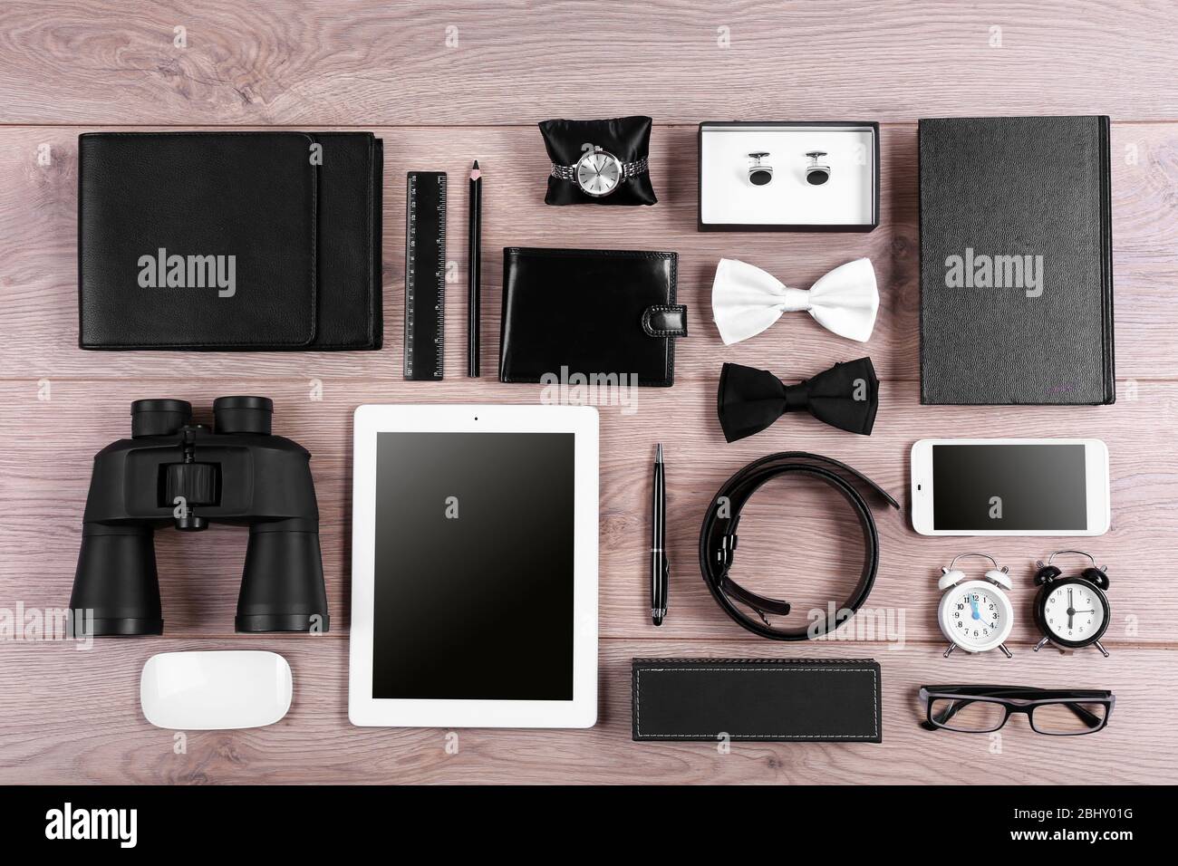 Set of black and white accessories on wooden table, top view Stock ...