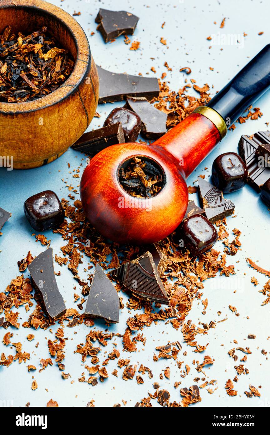 Chocolate flavored tobacco for smoking pipes.Tobacco pipe filled with ...