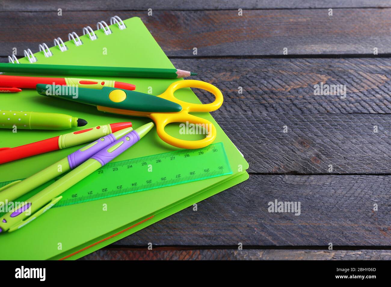 Colorful stationery on wooden table, closeup Stock Photo - Alamy