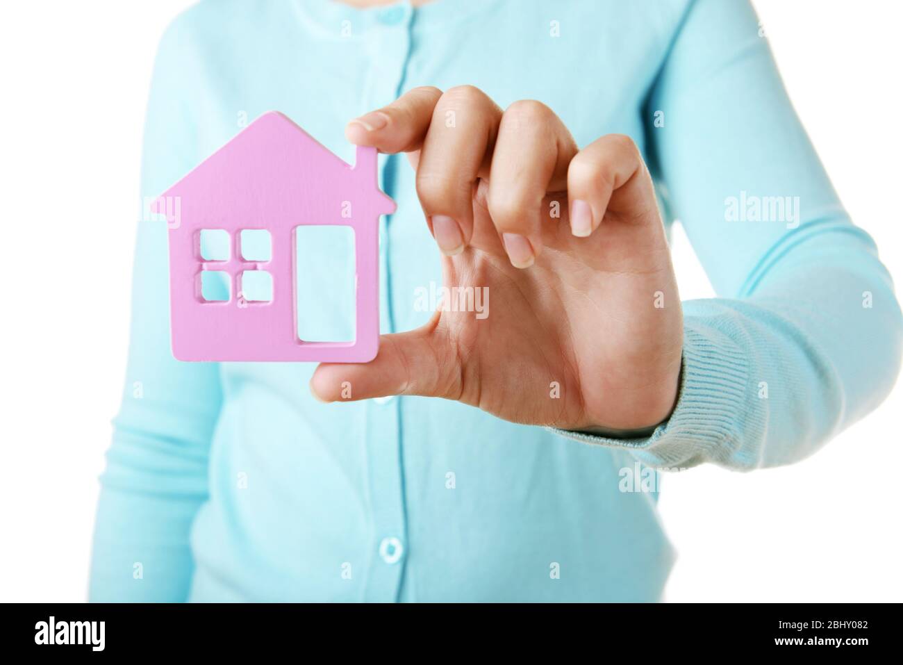 Female hand with small model of house isolated on white Stock Photo - Alamy