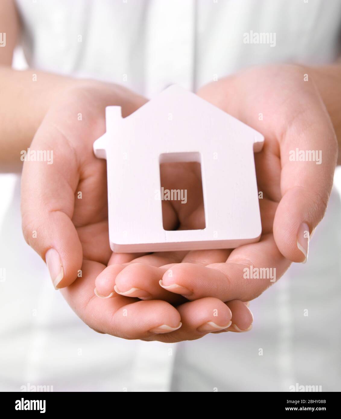 Female hands with small model of house, closeup Stock Photo - Alamy