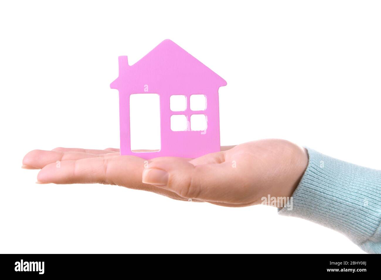 Female hand with small model of house isolated on white Stock Photo - Alamy