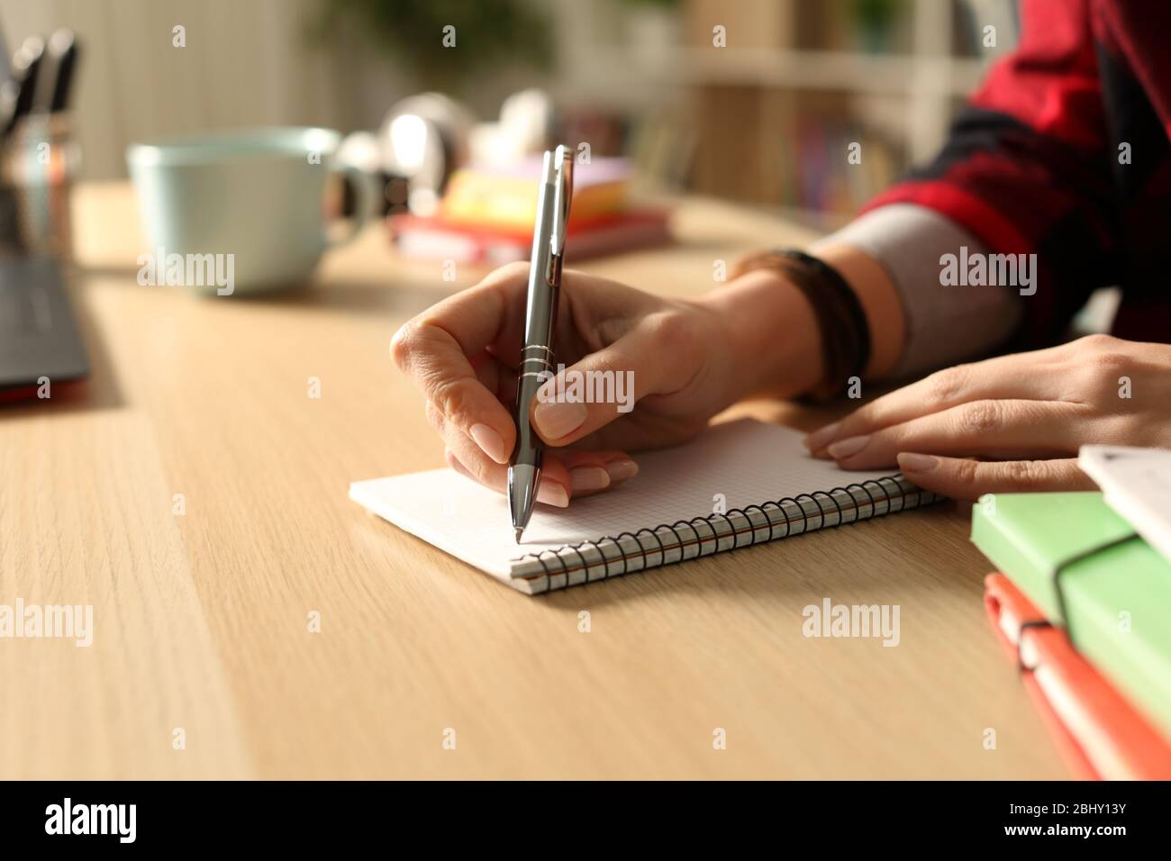 Close up of student girl hands writing notes on notebook at night Stock ...