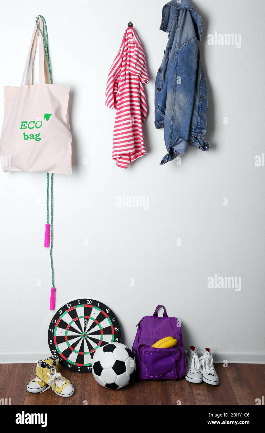 School bag hanging on hook hi-res stock photography and images - Alamy