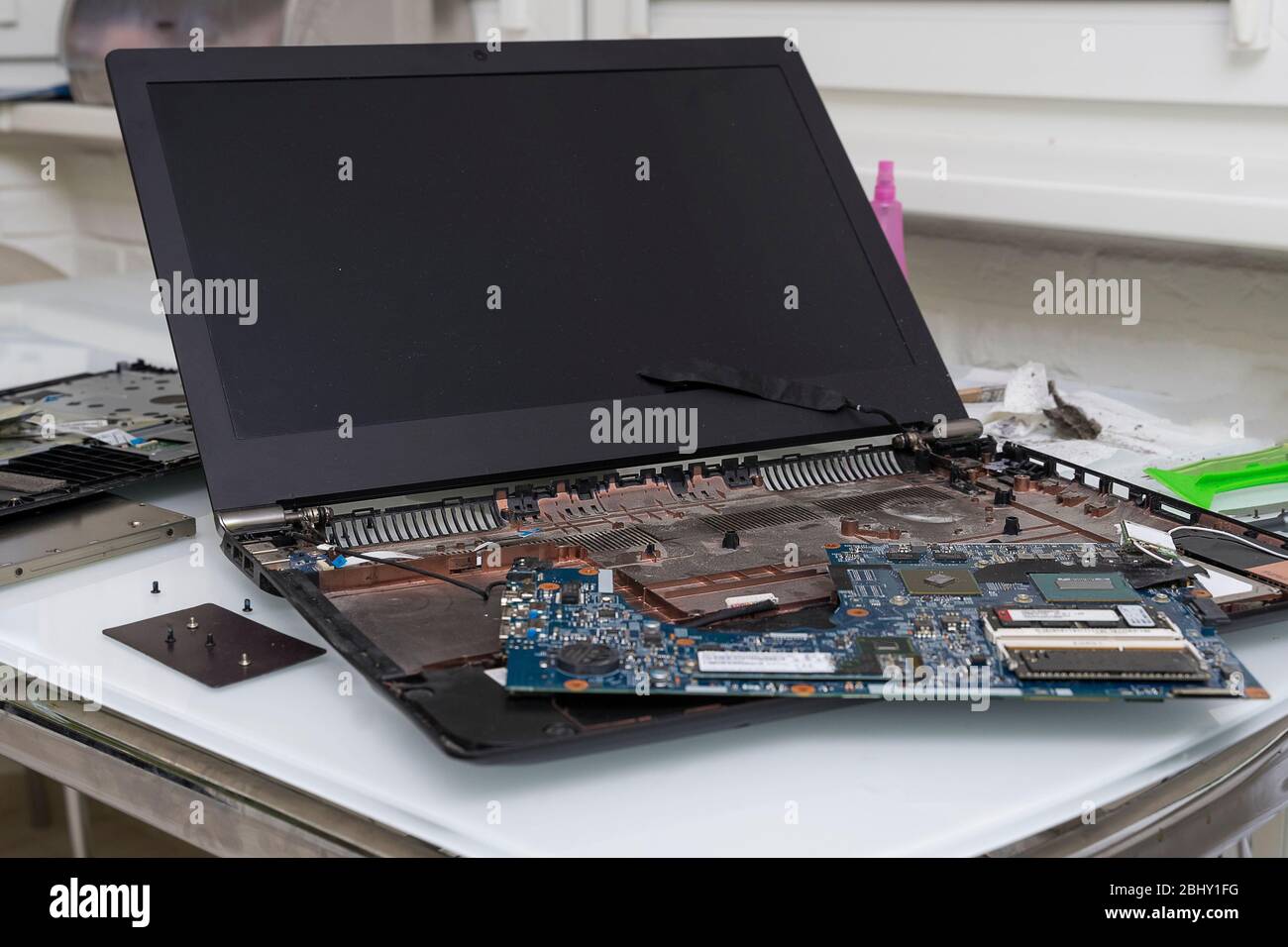 disassembled laptop is on the table. computer repair Stock Photo - Alamy