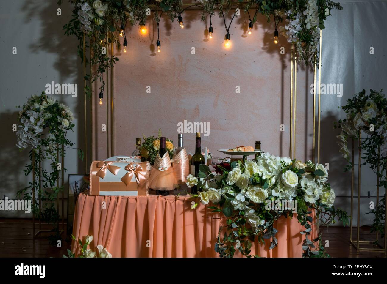 beautifully decorated table of the bride and groom in peach colors ...