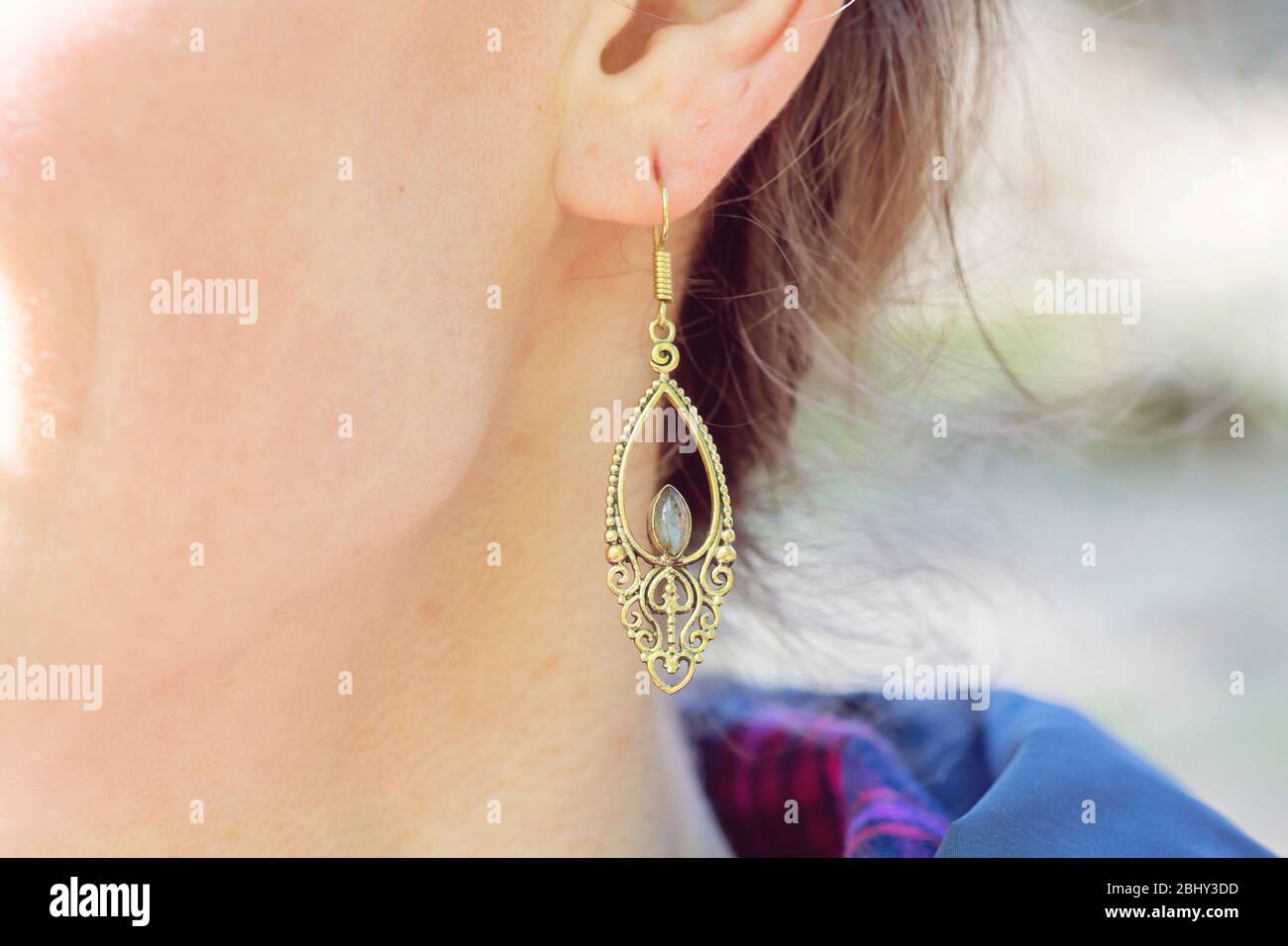 Outdoor detail of female ear wearing beautiful elegant earring Stock ...