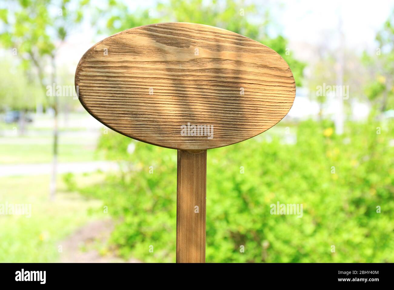 Wooden signboard on nature background Stock Photo - Alamy