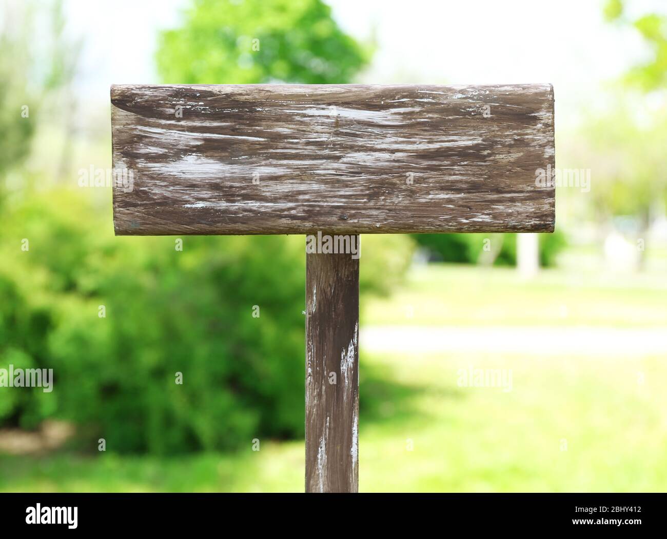 Wooden signboard on nature background Stock Photo - Alamy
