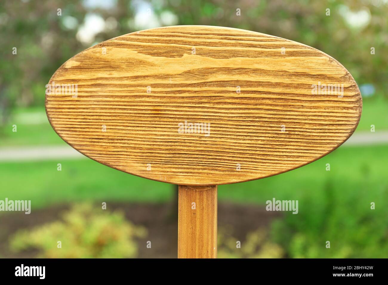 Wooden signboard on nature background Stock Photo - Alamy