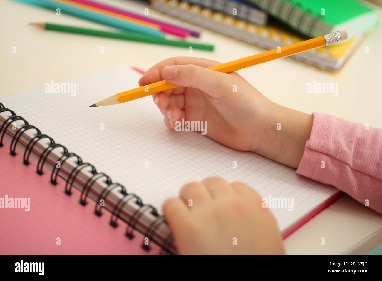 Kids hands drawing on notebook at desktop, closeup Stock Photo - Alamy