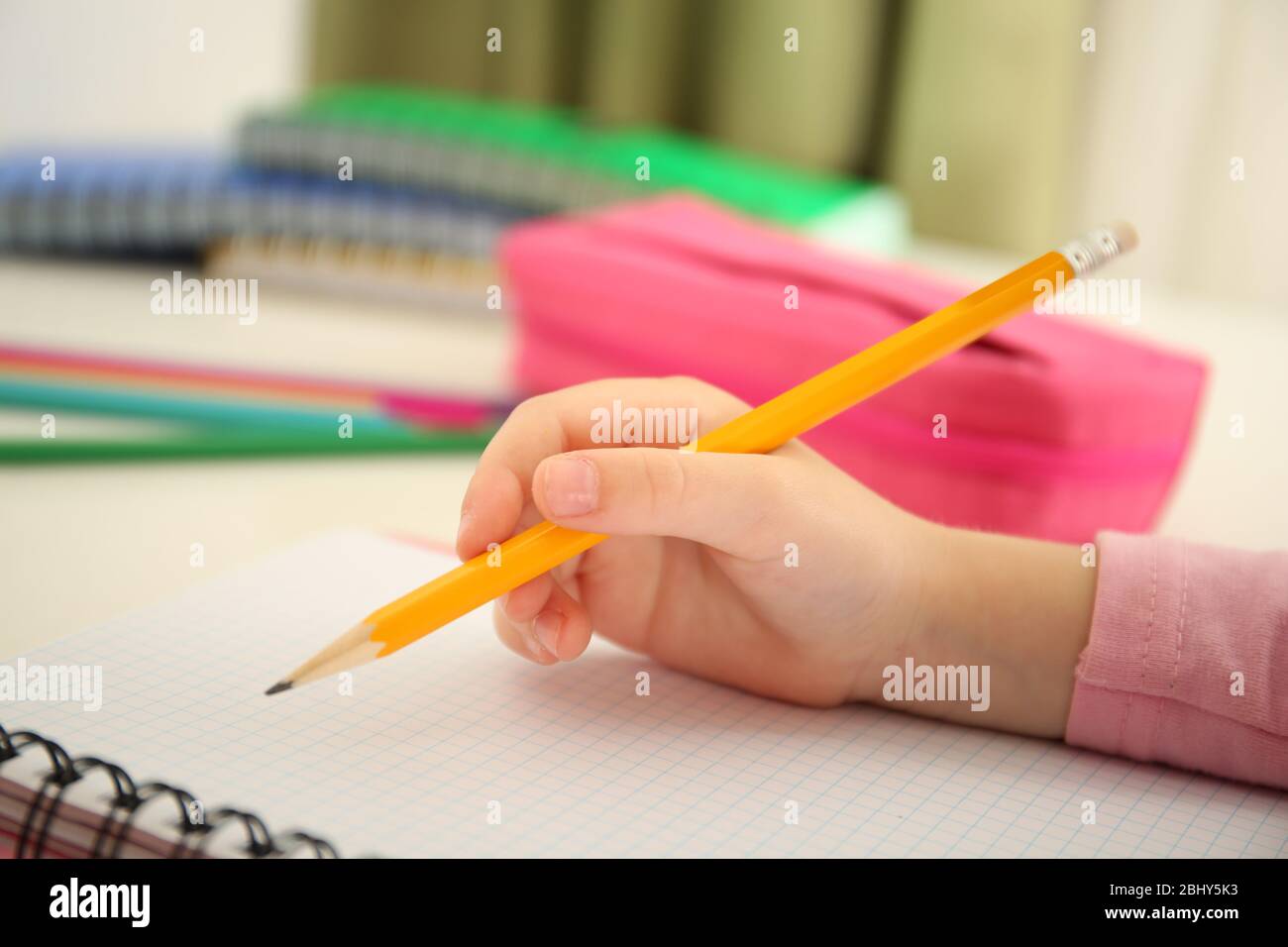 Kids hand drawing on notebook at desktop, closeup Stock Photo - Alamy