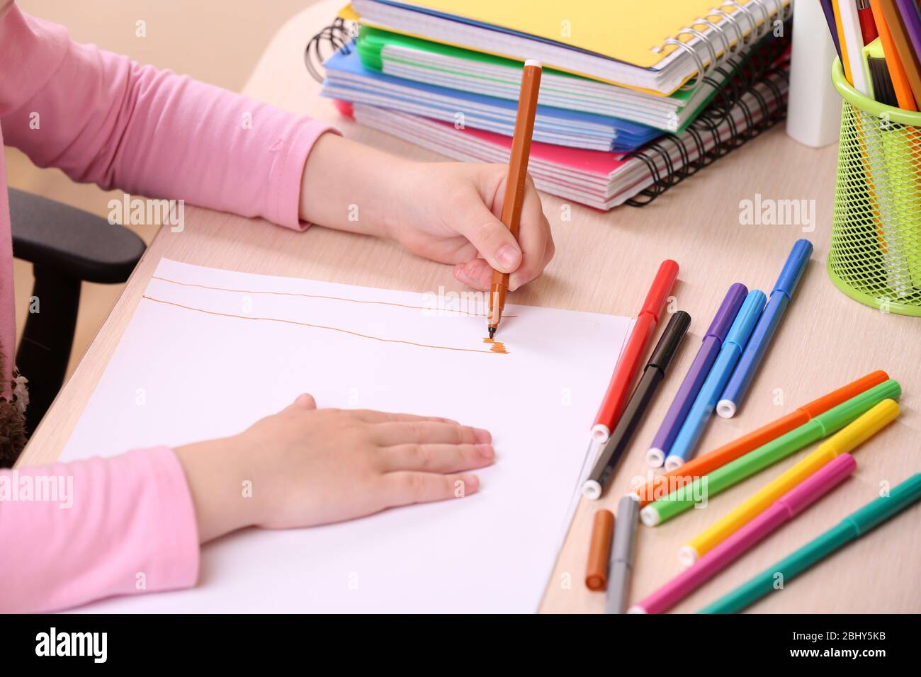 Kids hands drawing on notebook at desktop, closeup Stock Photo - Alamy