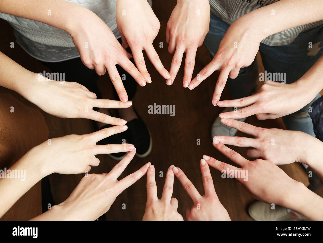 Group of female hands together, closeup Stock Photo - Alamy
