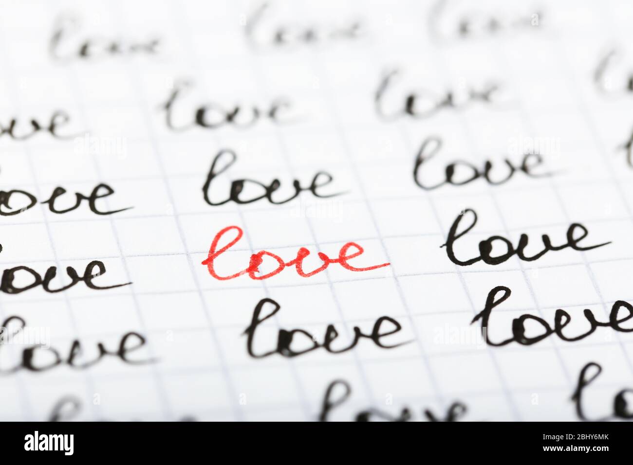 Words LOVE written on sheet of paper background Stock Photo - Alamy