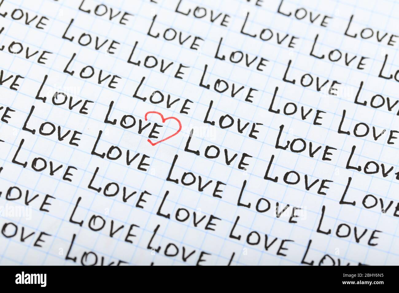 Words LOVE written on sheet of paper background Stock Photo - Alamy