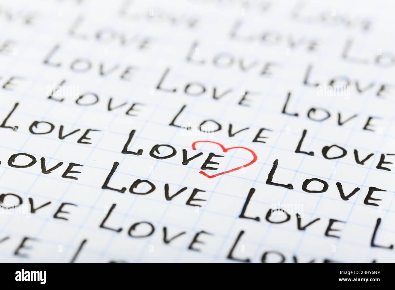 Words LOVE written on sheet of paper background Stock Photo - Alamy