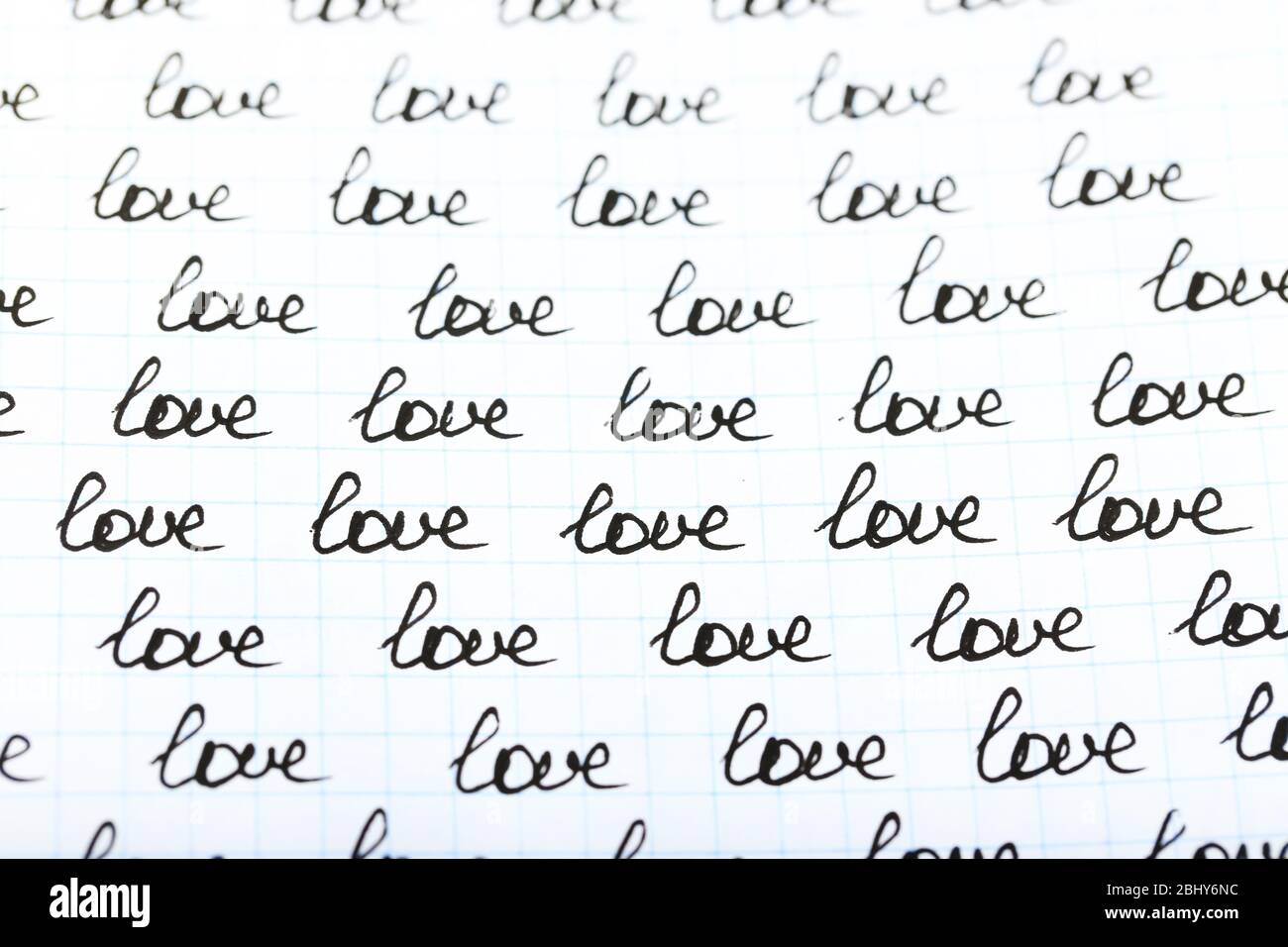 Words LOVE written on sheet of paper background Stock Photo - Alamy