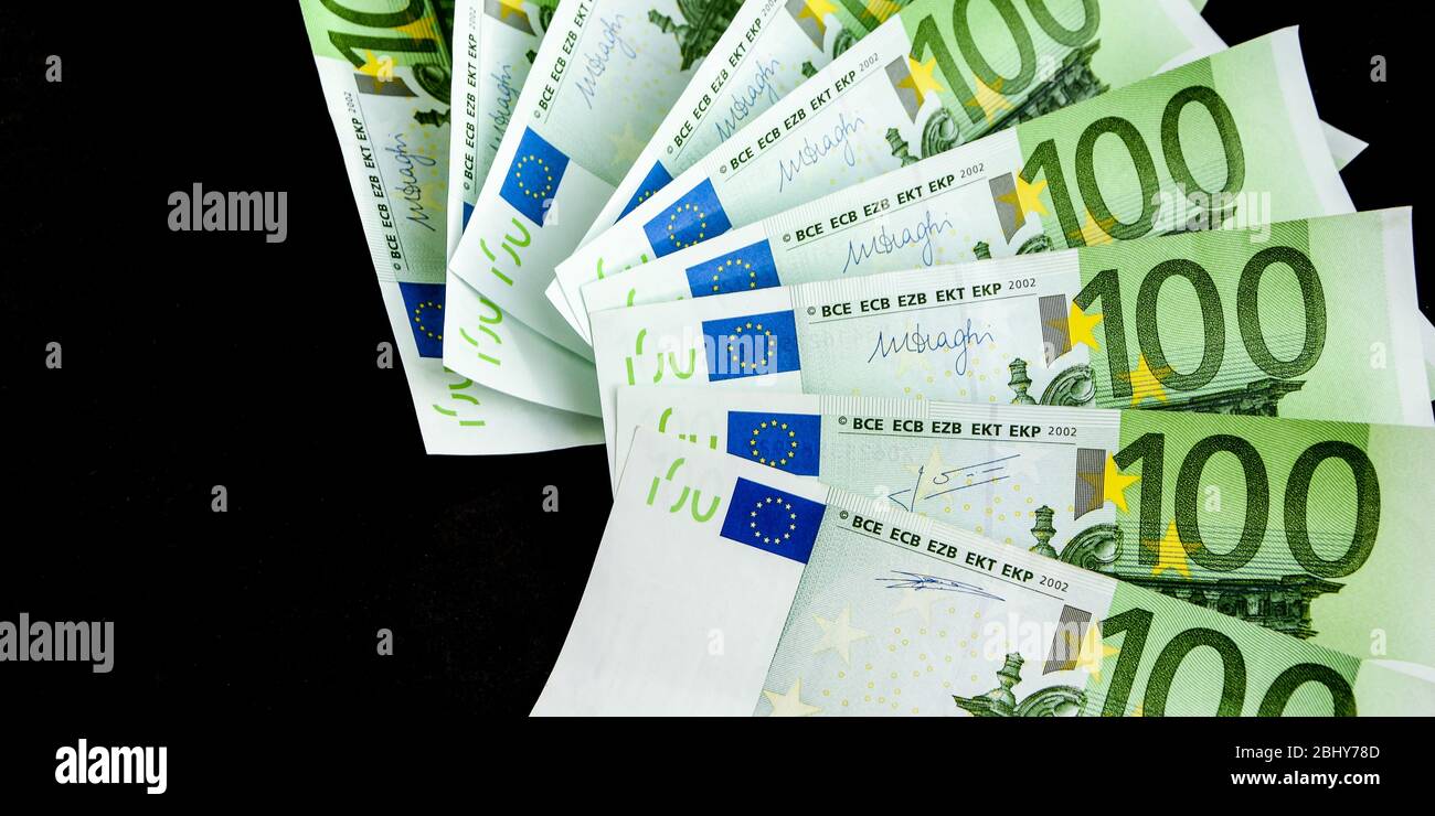 100 Euro - full set of banknotes of euro isolated on black Stock Photo ...