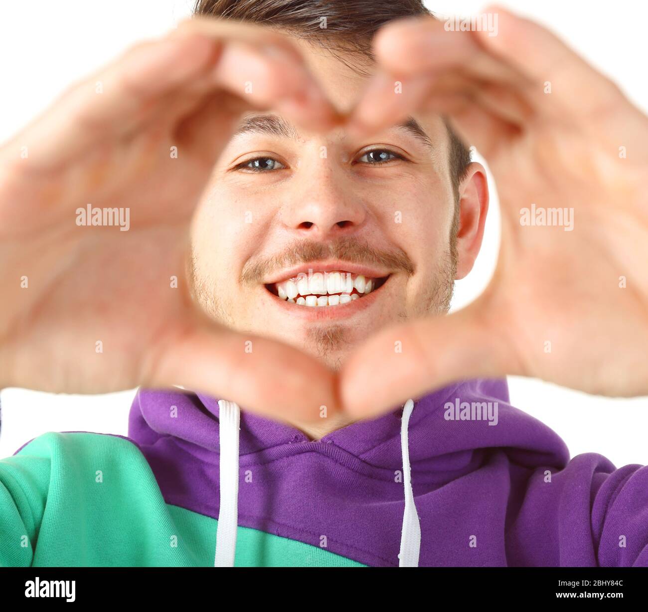 Handsome young man makes heart hi-res stock photography and images - Alamy