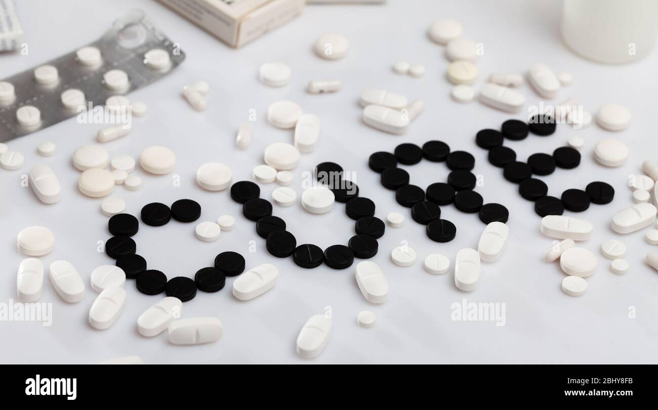 Various pills formed word CURE on white background, medicine concept ...