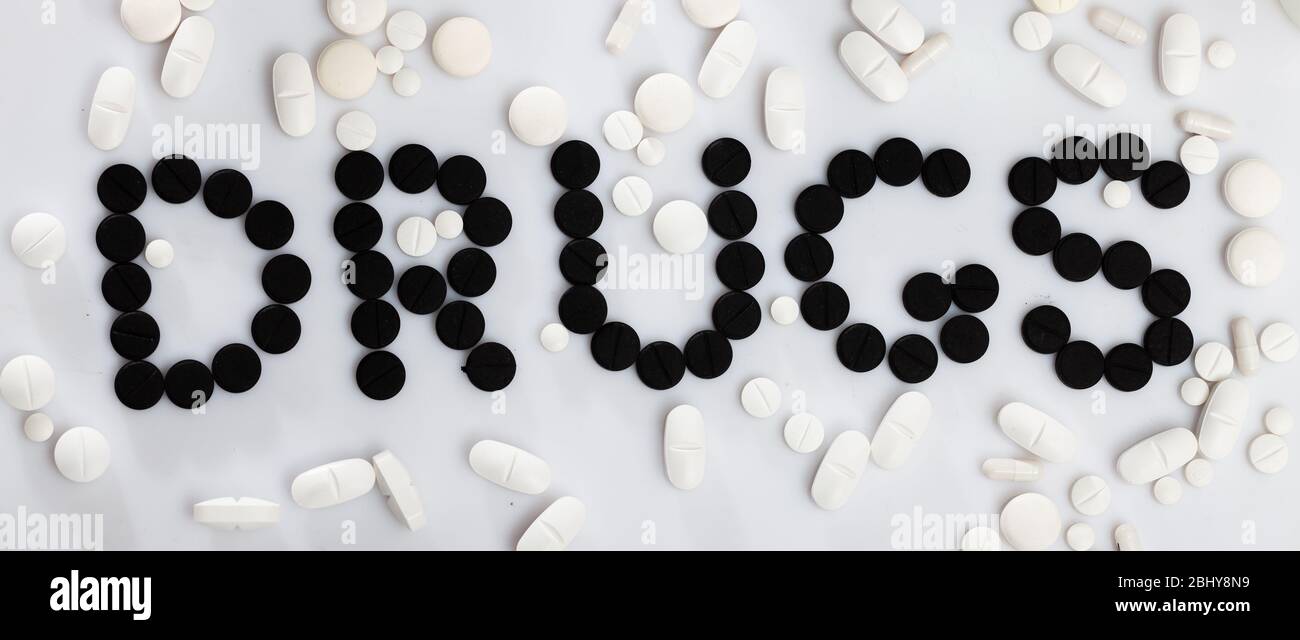 Various pills formed word Drugs on white background. medicine concept ...