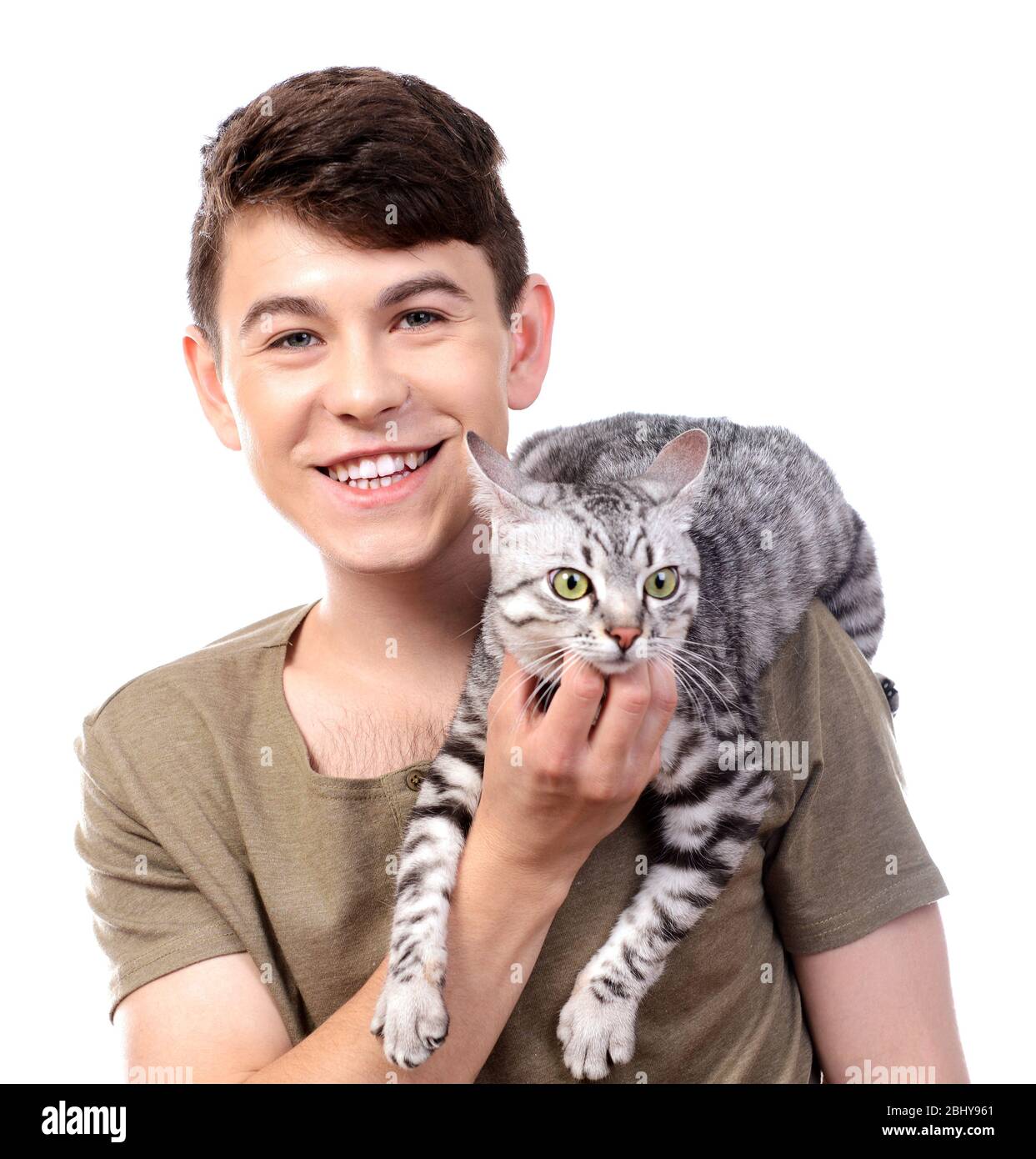 Handsome young man with cute cat isolated on white Stock Photo - Alamy
