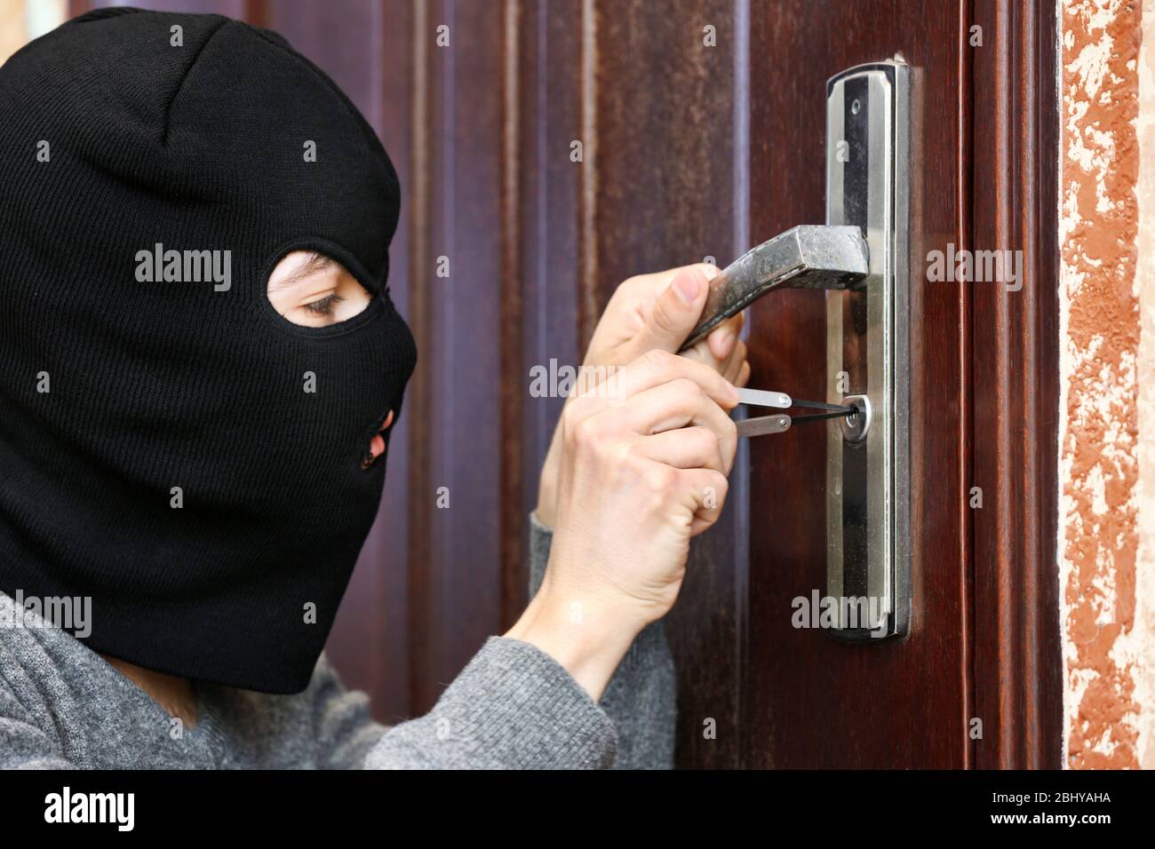 Burglar breaking into house Stock Photo - Alamy