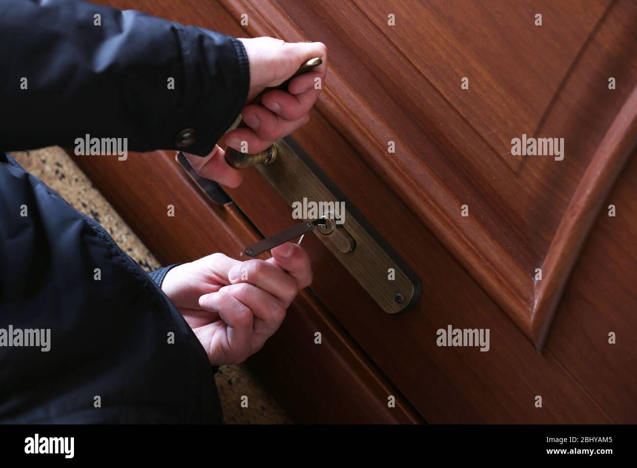 Burglar breaking into house Stock Photo - Alamy