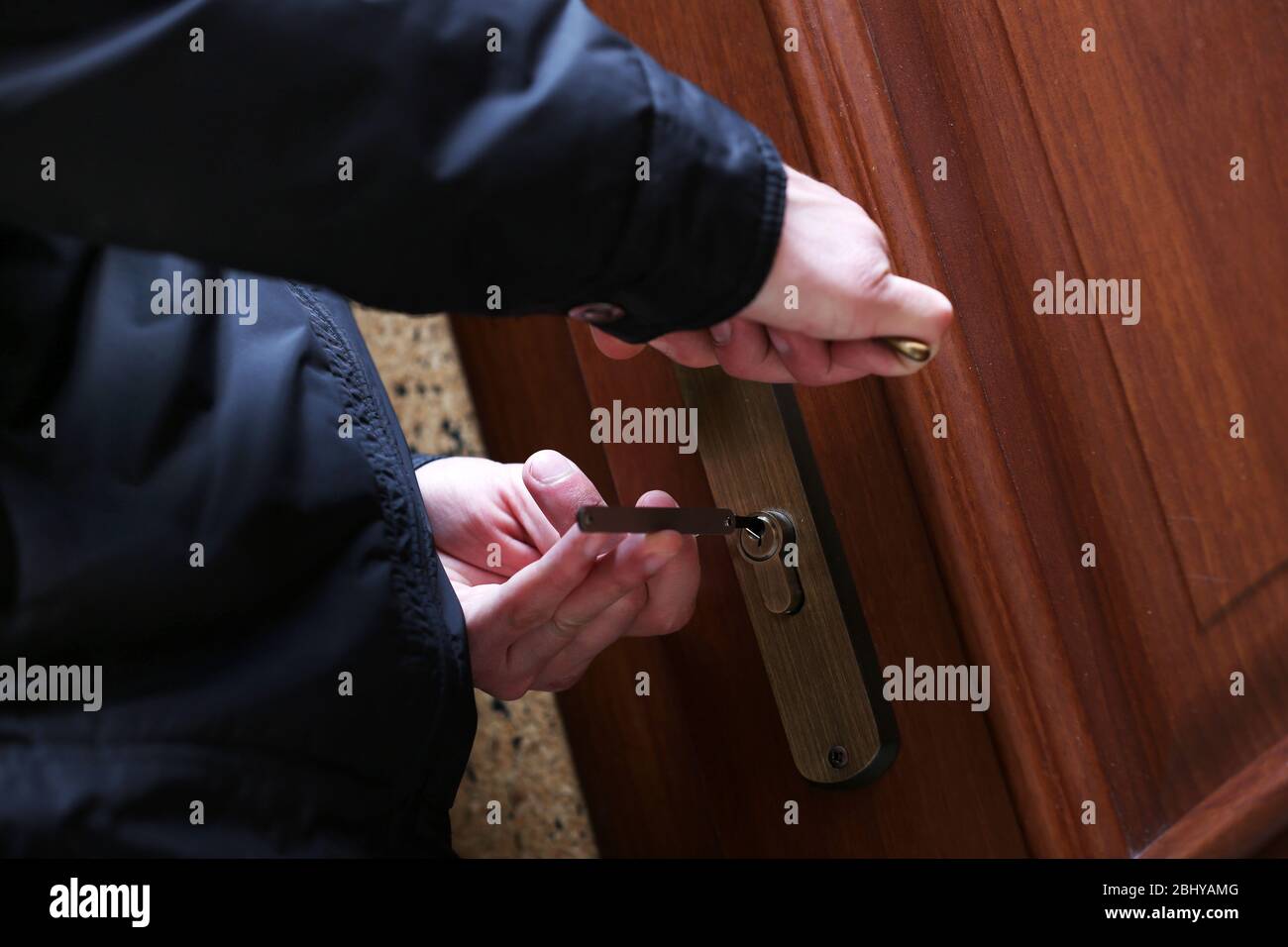 Burglar breaking into house Stock Photo - Alamy