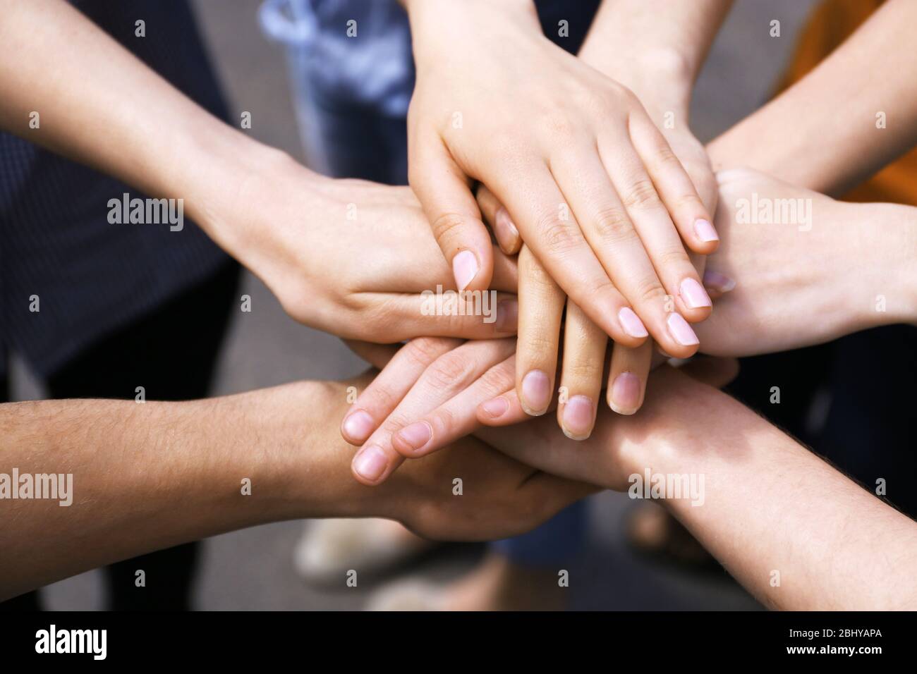 United hands outdoors Stock Photo - Alamy
