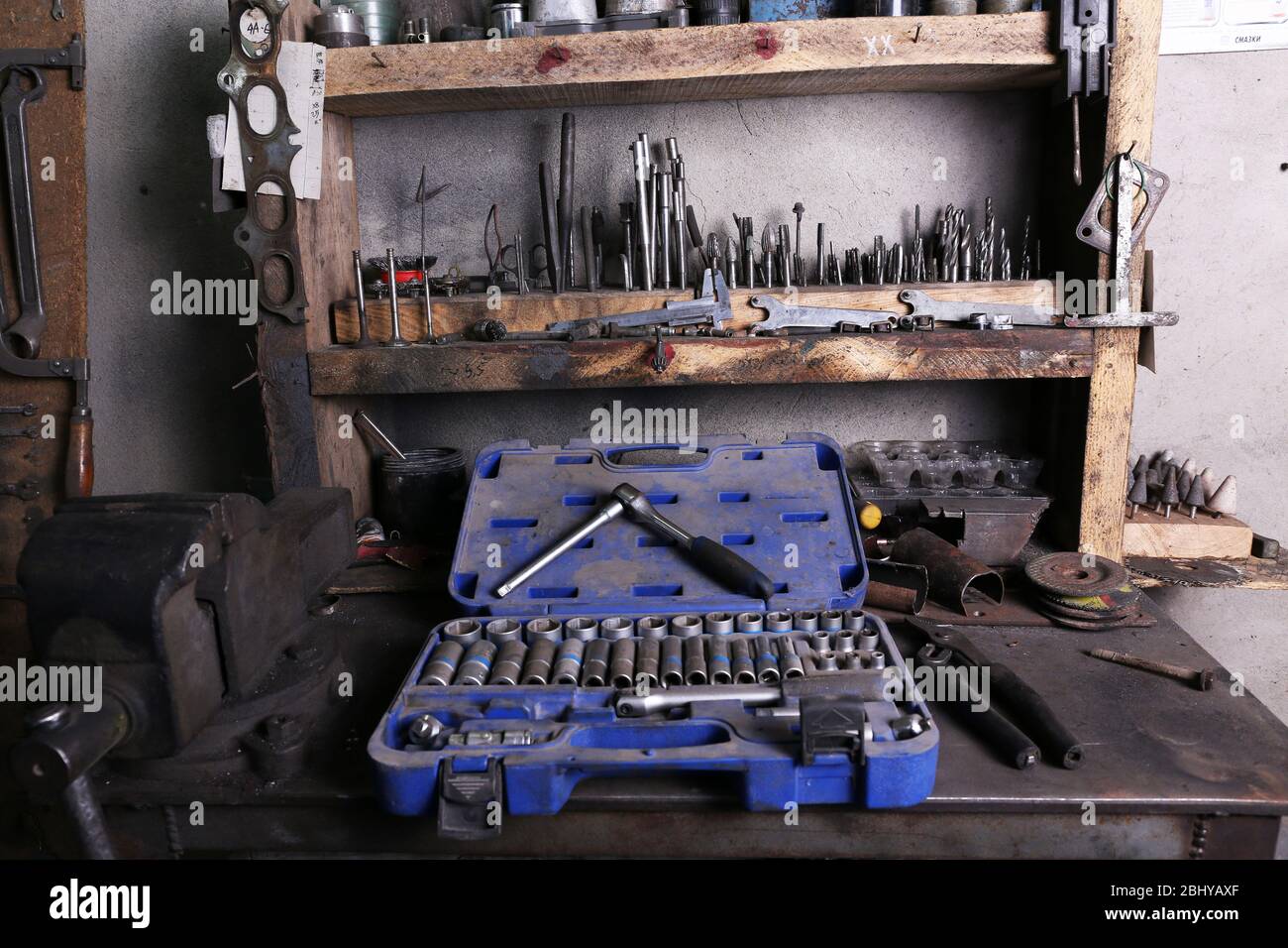 Different tools on workplace in garage Stock Photo - Alamy