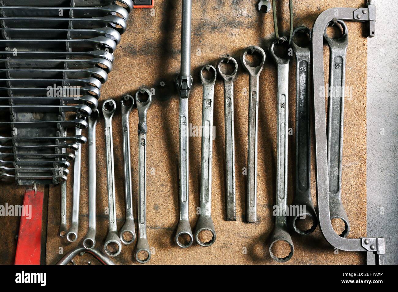 Different tools on workplace in garage Stock Photo - Alamy
