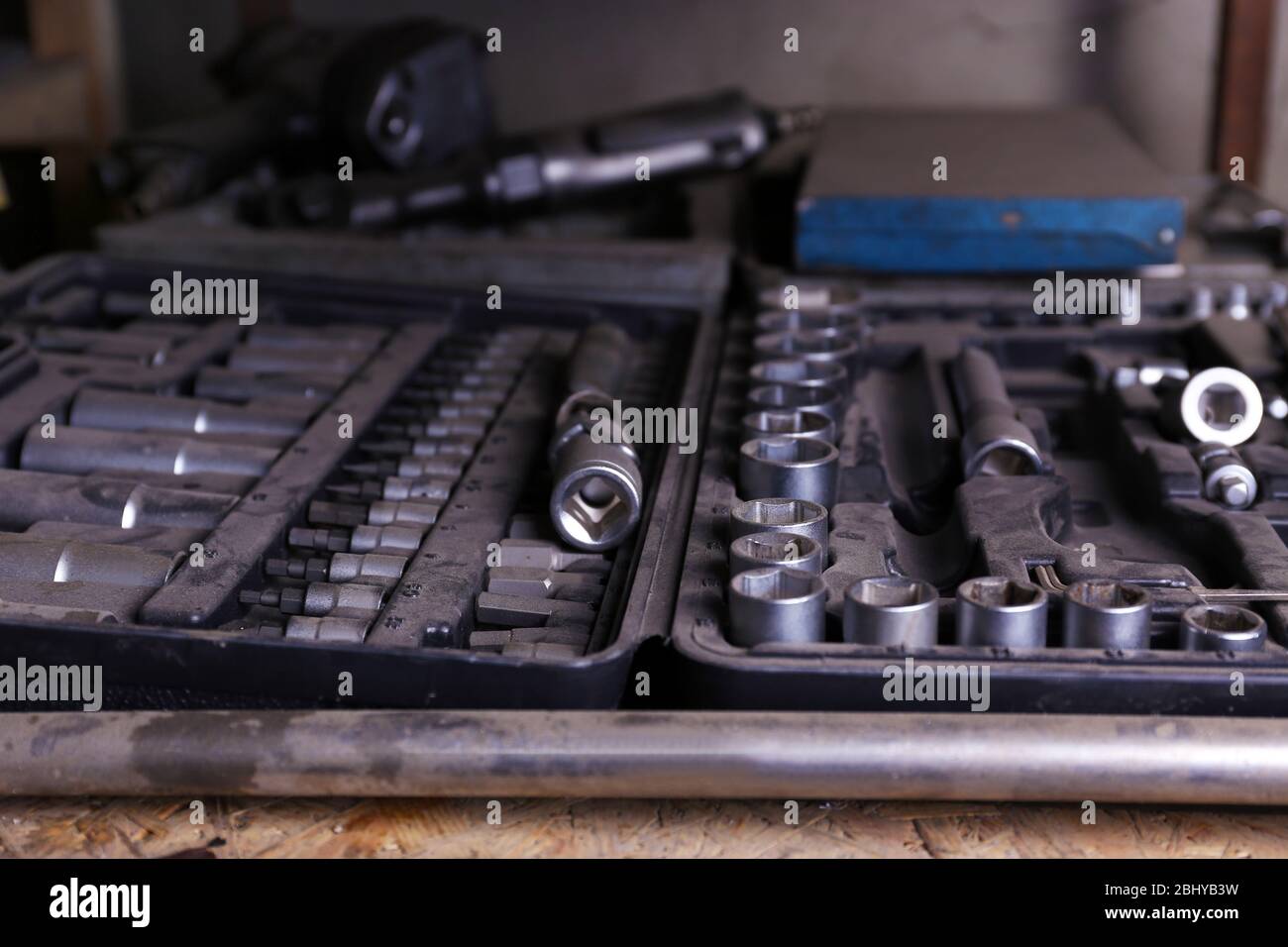 Different tools on workplace in garage Stock Photo - Alamy