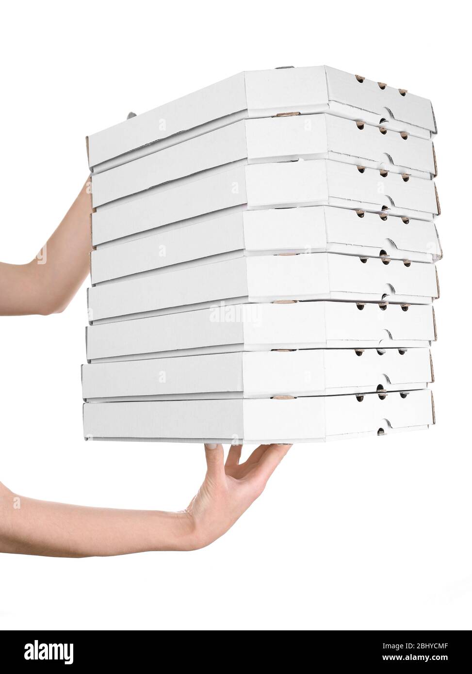 Hand holding pizza boxes isolated on white Stock Photo - Alamy