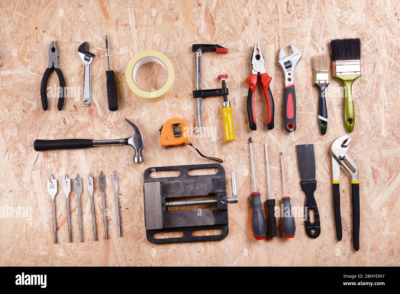 Set of tools on plywood, top view Stock Photo - Alamy