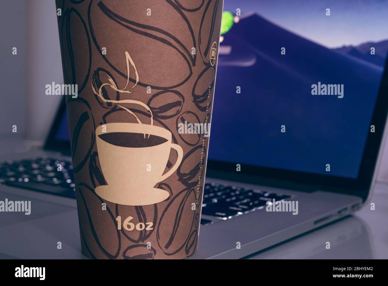 Laptop Computer and Cup of Coffee on desk Stock Photo - Alamy