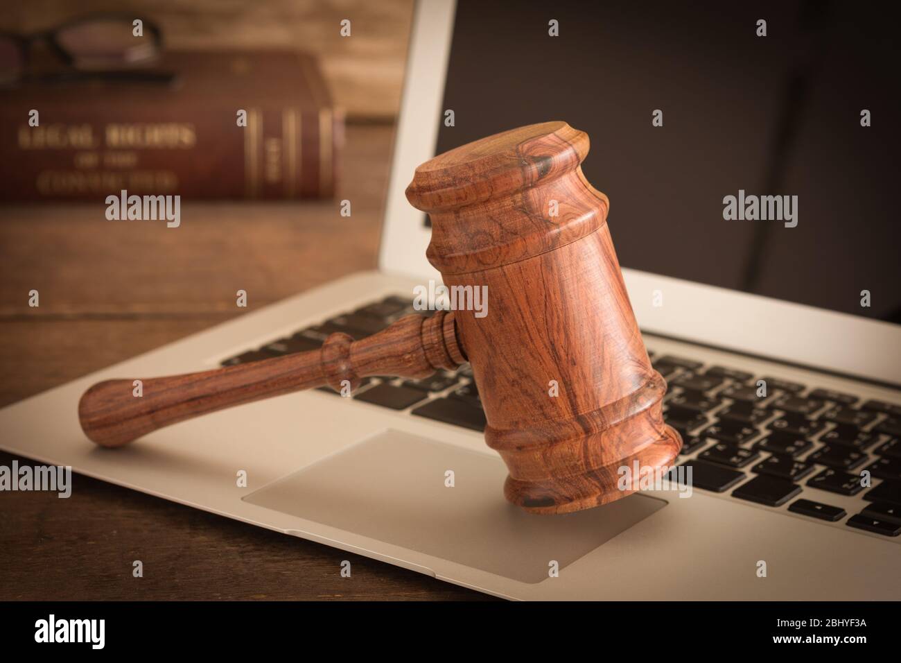 wooden judges gavel on keyboard laptop computer at law fiam Stock Photo ...