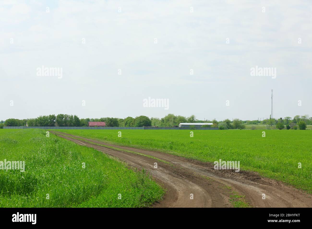 Country road over blue sky background Stock Photo - Alamy