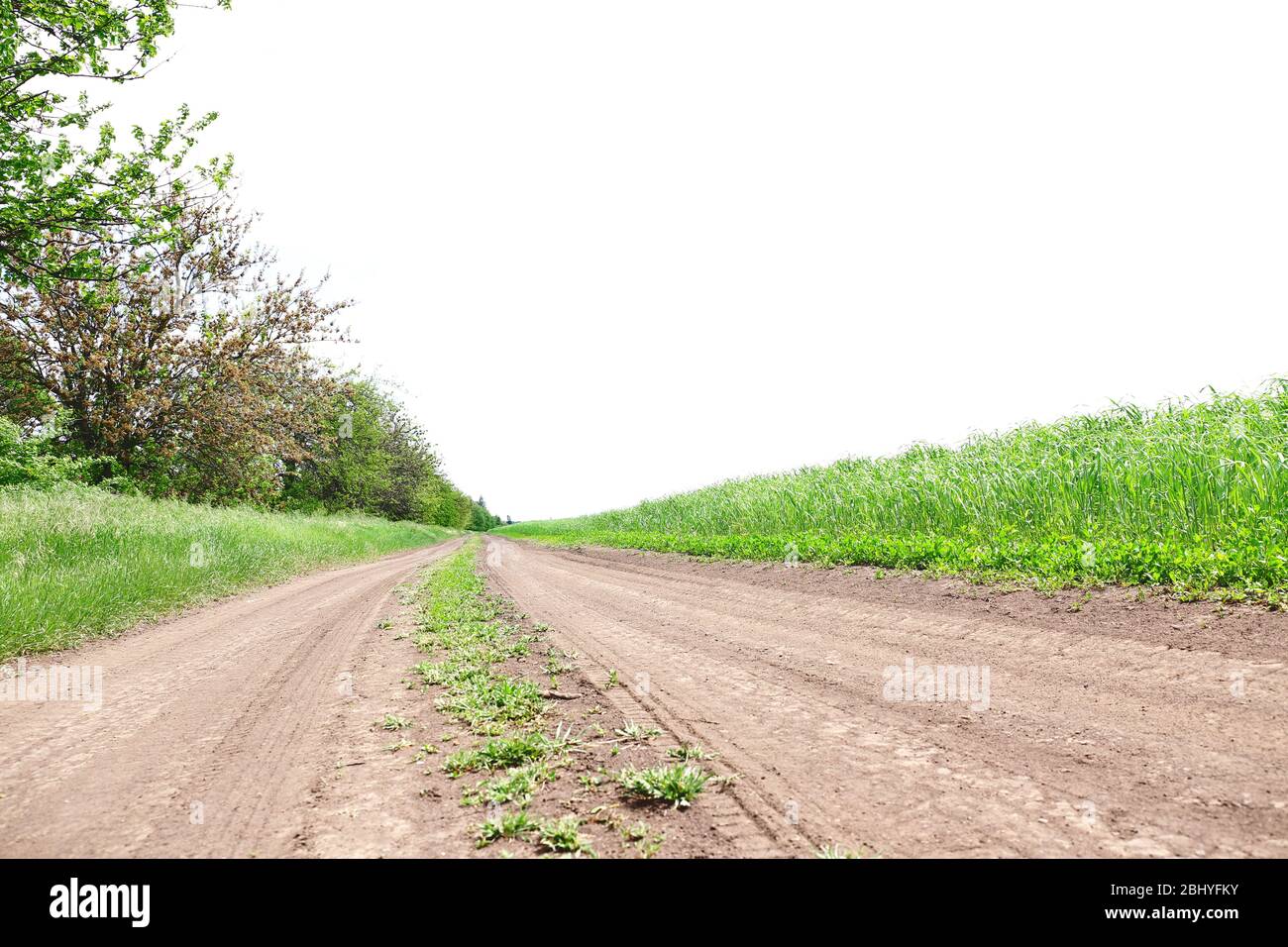 Country road over blue sky background Stock Photo - Alamy