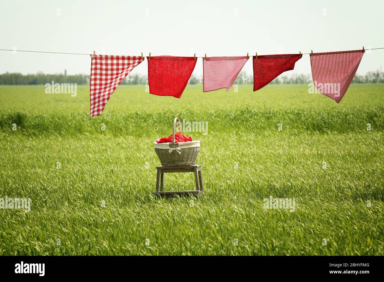 Laundry line with clothes in field Stock Photo - Alamy