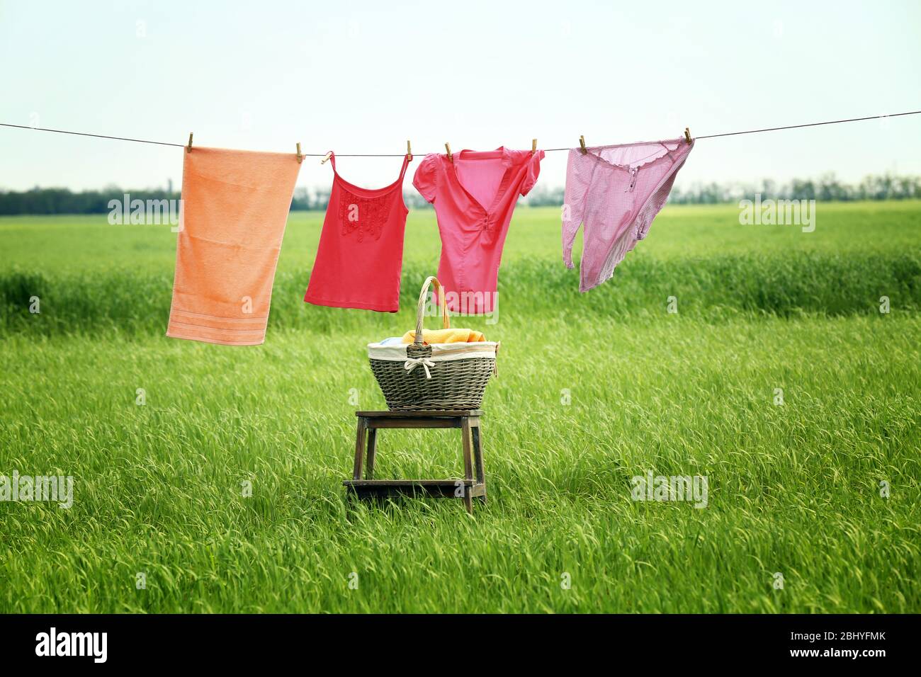Laundry line with clothes in field Stock Photo - Alamy